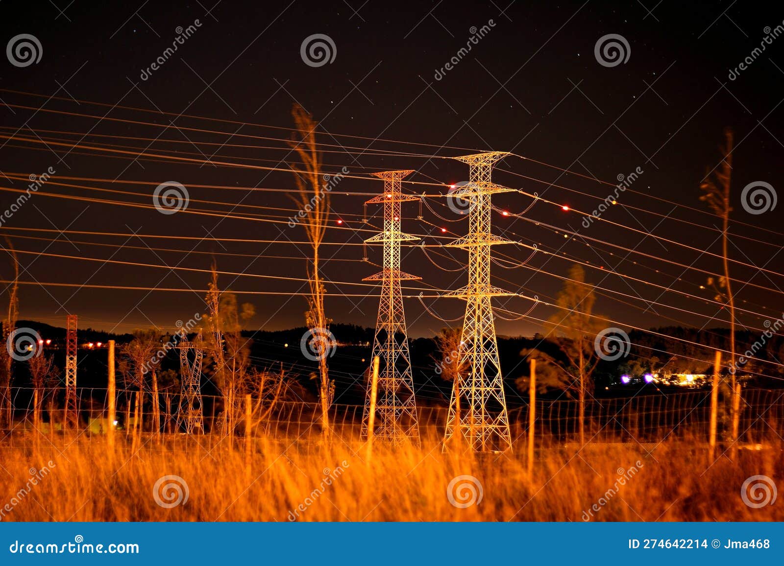 High Voltage Electrical Towers on a Dark Background Stock Photo - Image ...