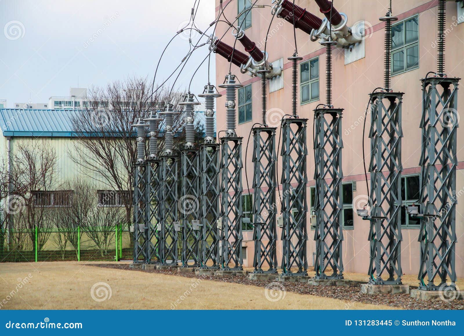 High-voltage Poles are Installed Next To the Building. Stock Image ...