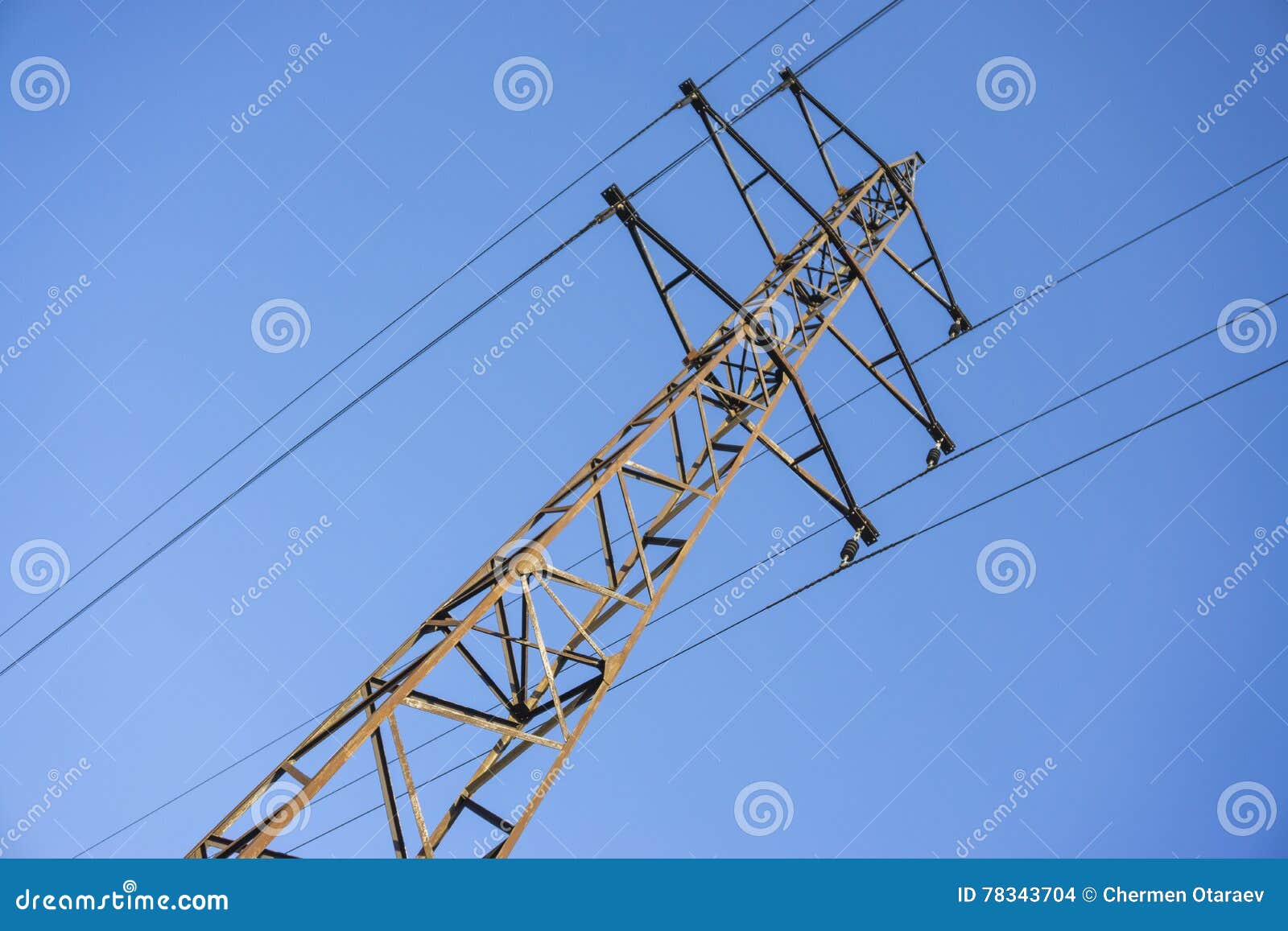 High Voltage Power Grid Pylon Against Blue Sky Stock Photo - Image of ...