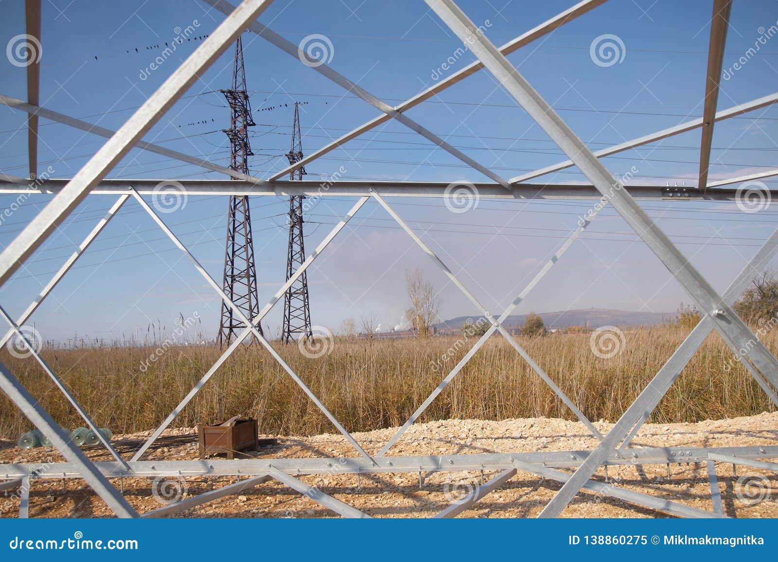 High-voltage Power Line in an Industrial Suburb. Installation of ...