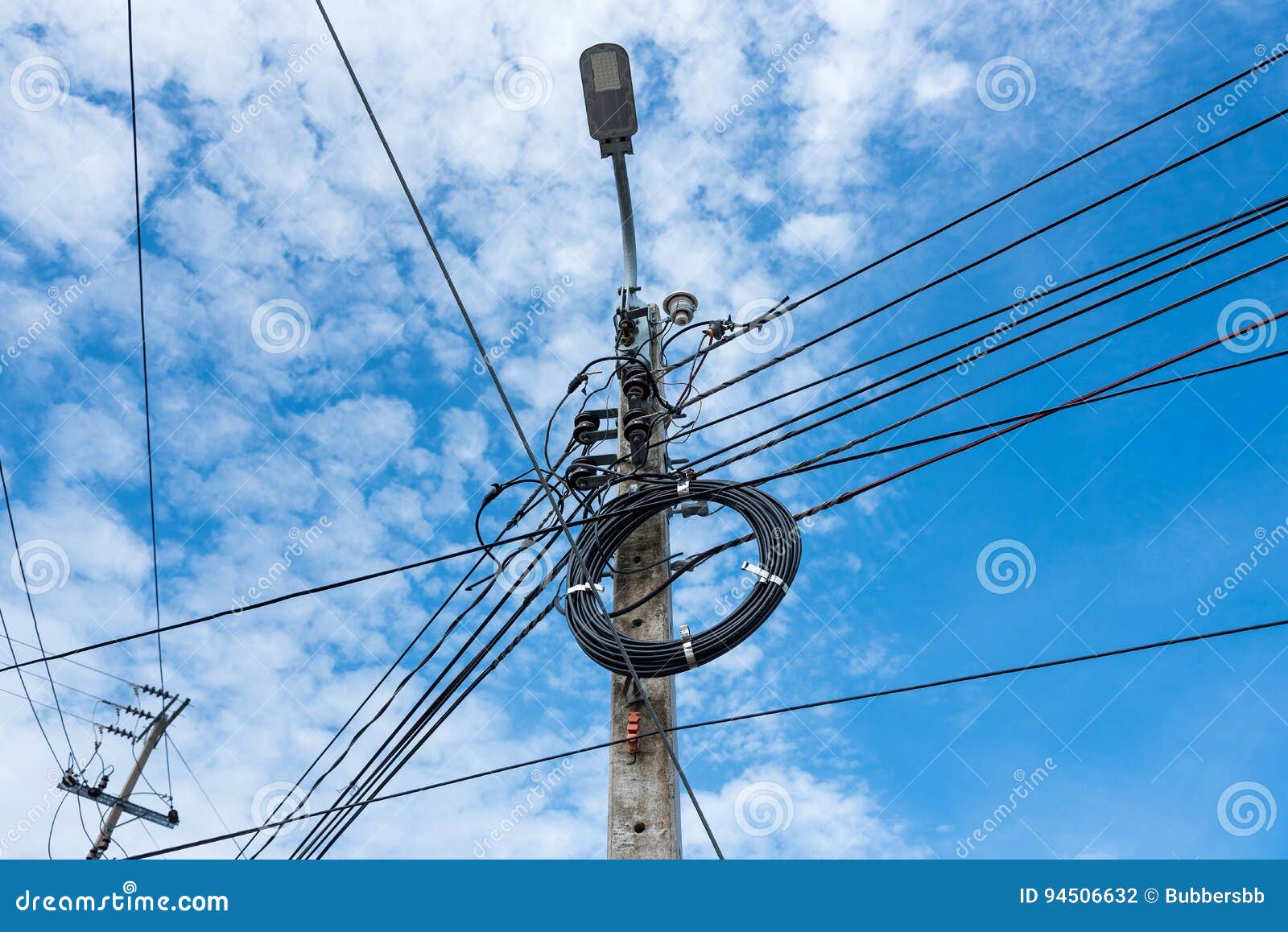 High Voltage Power Line with the Lamp on the Pole. Stock Photo - Image ...