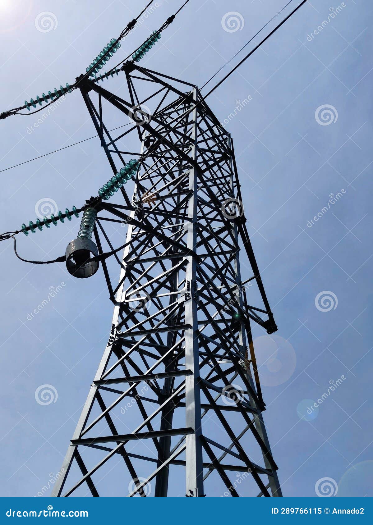 High Voltage Power Line Tower Against a Clear Blue Sky Stock Image ...