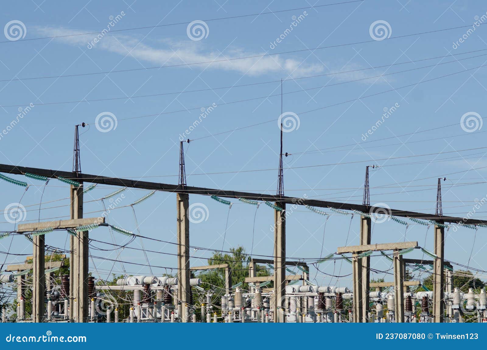 High Voltage Power Lines on Background of Blue Sky and Green Vegetation ...