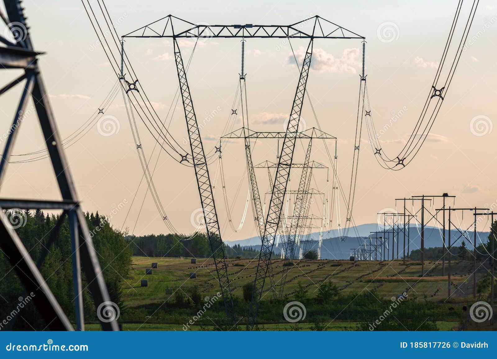 High Voltage Power Lines Draped Over Farm Fields Stock Photo - Image of ...