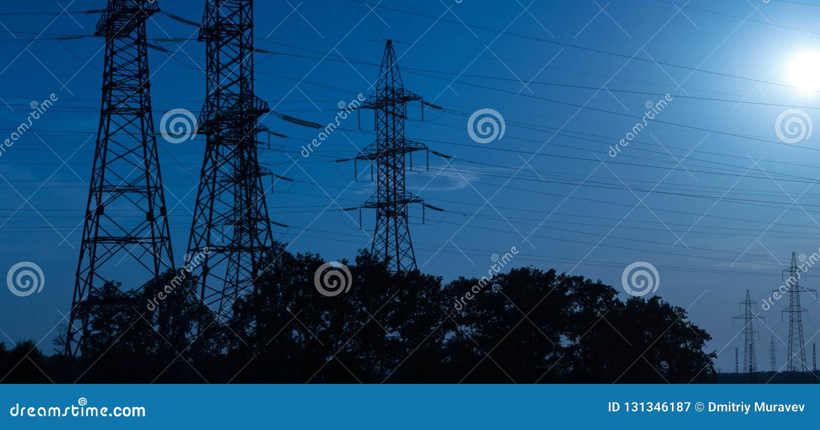 High-voltage Power Lines in the Light of the Rays of the Setting Sun ...