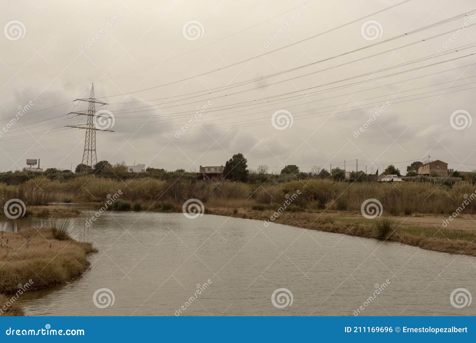 High Voltage Power Lines Over the River Stock Photo - Image of danger ...