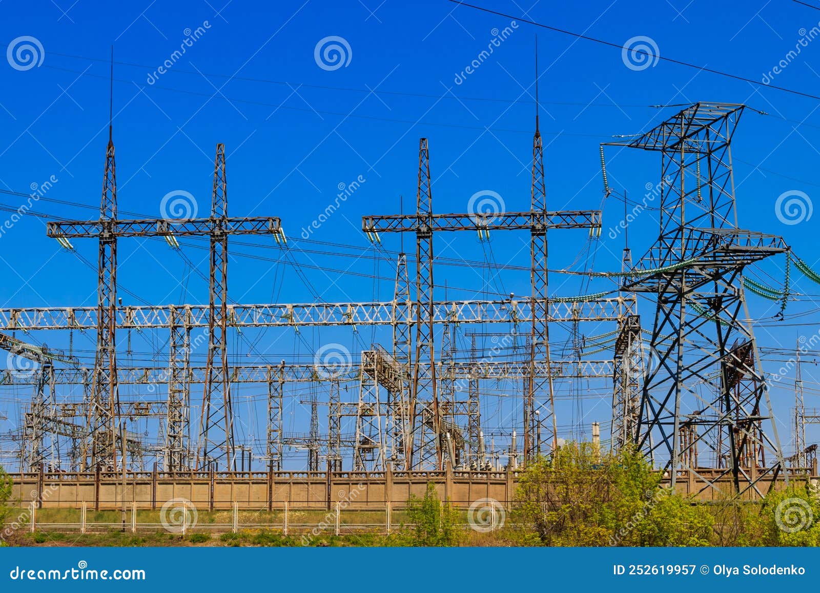 High Voltage Power Lines Towers on Blue Sky Background Stock Image ...