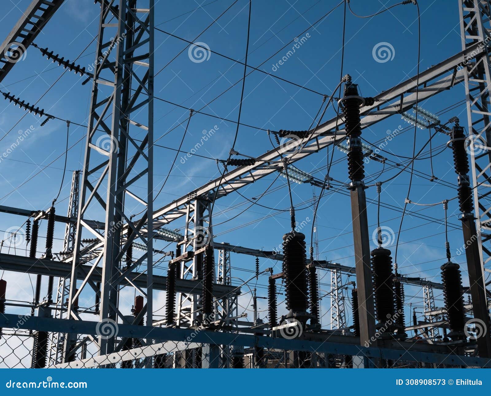 High-voltage Power Lines of Transformer Substation Against the Blue Sky ...