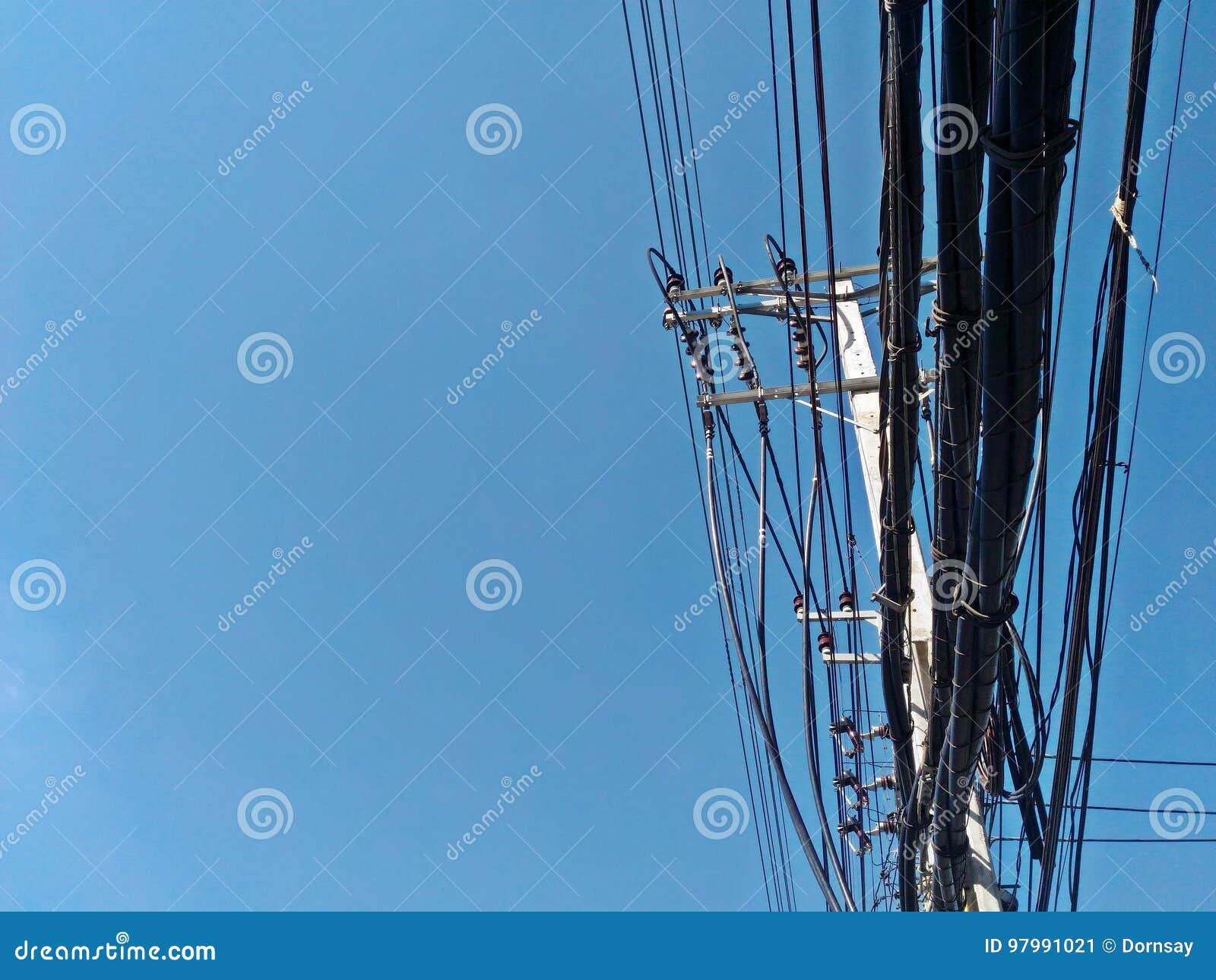 High Voltage Power Pole with Wires Tangled and Communication Pole from ...