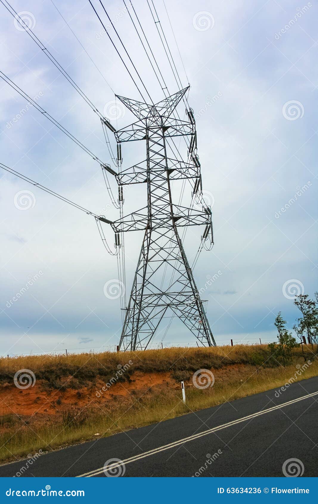 High Voltage Powerline Tower with Road in Forground. Stock Photo ...