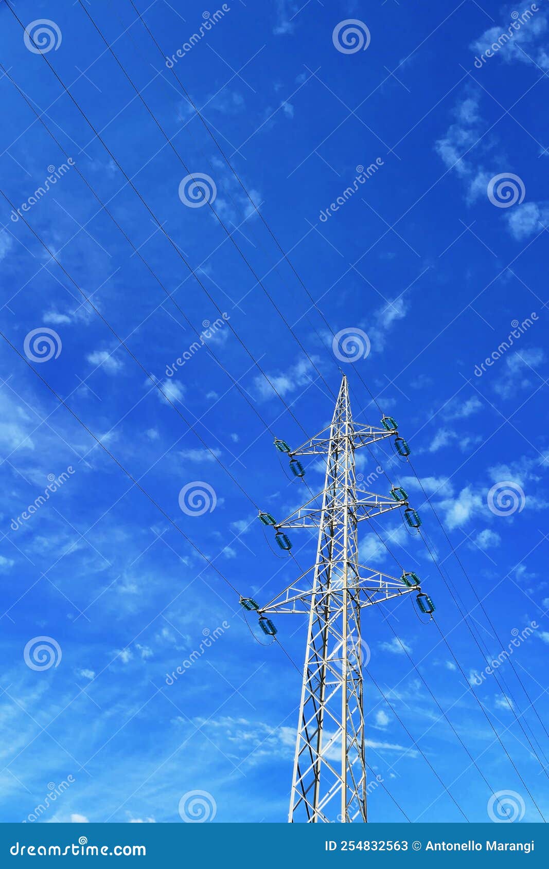 High Voltage Pylon View from Below Under Blue Cloudy Sky Stock Image ...