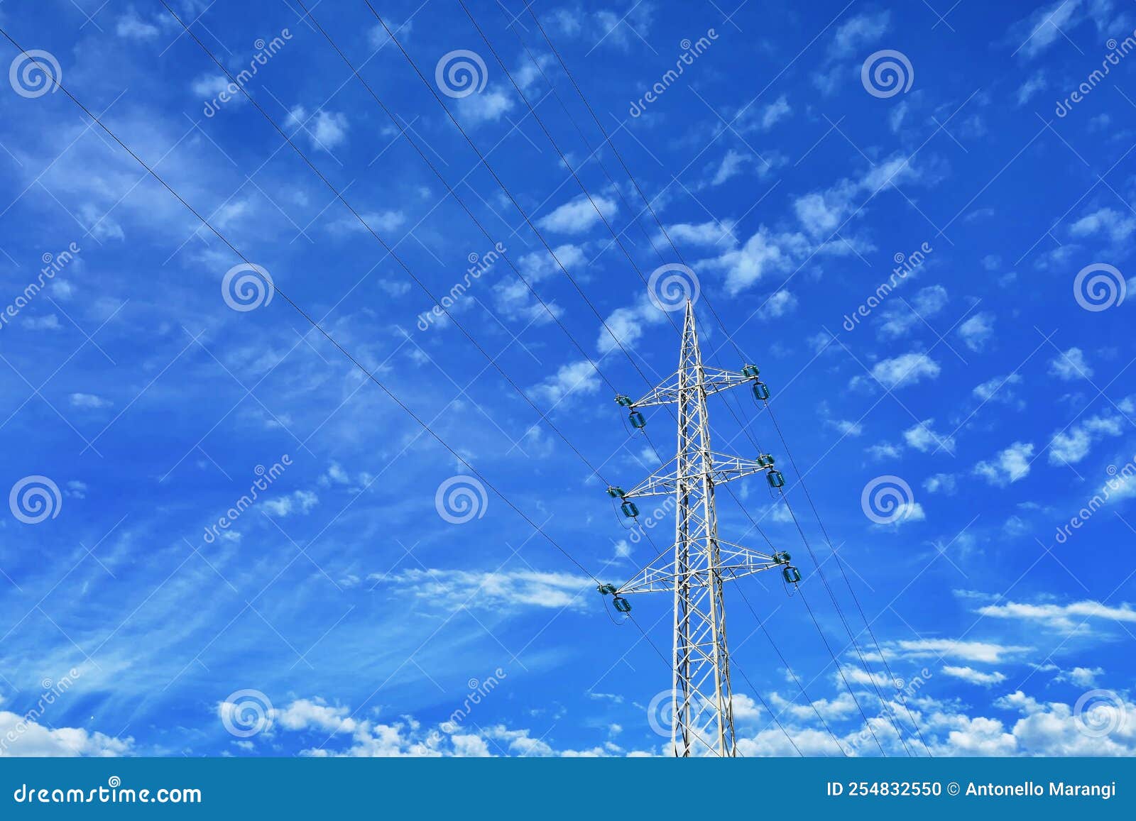 High Voltage Pylon View from Below Under Blue Cloudy Sky Stock Photo ...