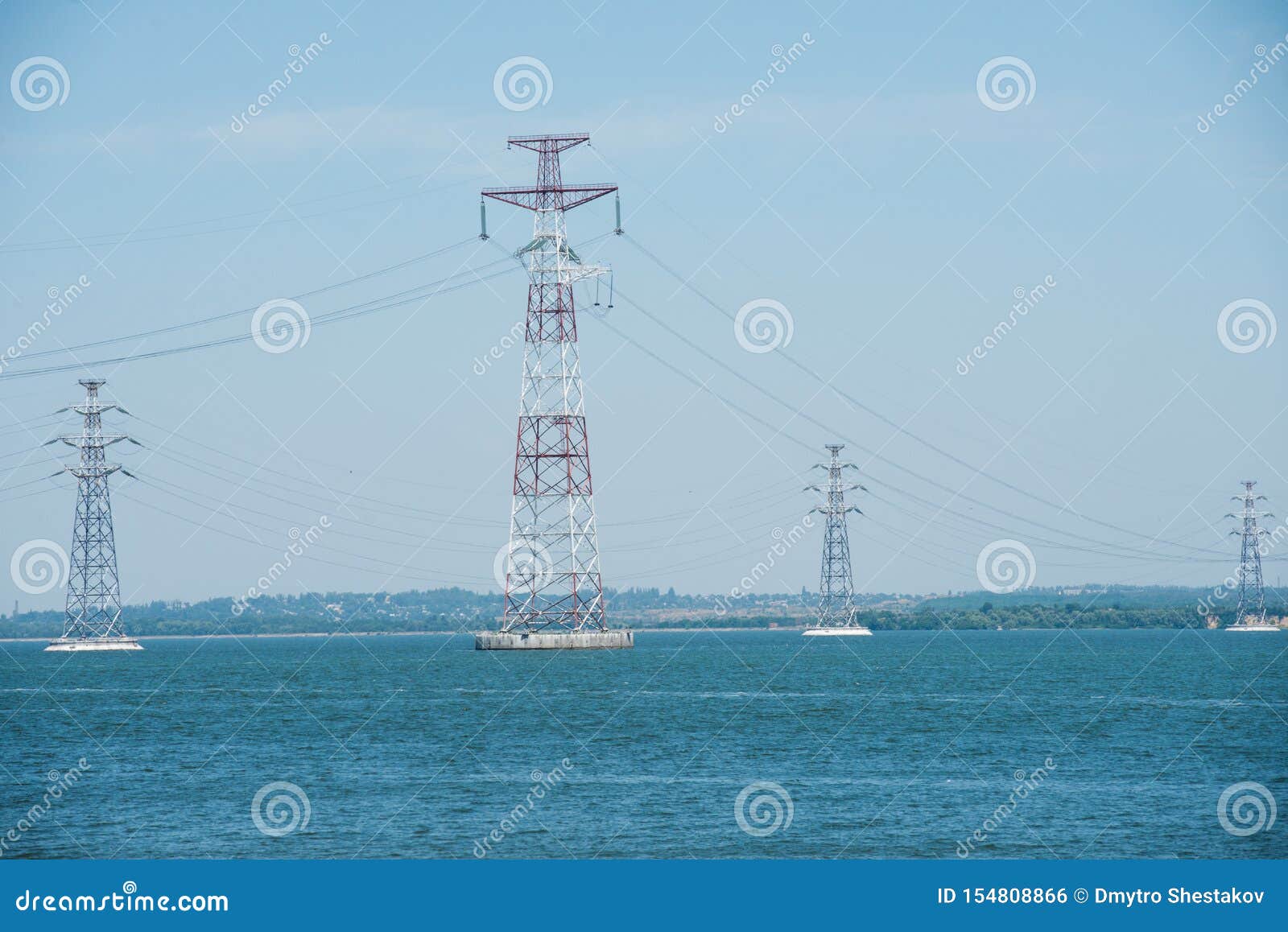 High-voltage Pylons of Power Lines on the River Stock Photo - Image of ...