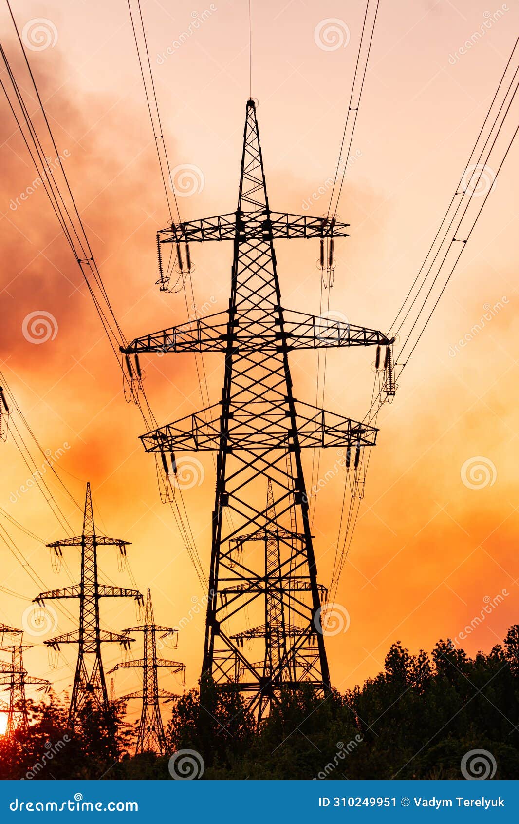 High Voltage Pylons Towering Over the Trees and Bushes Stock Image ...