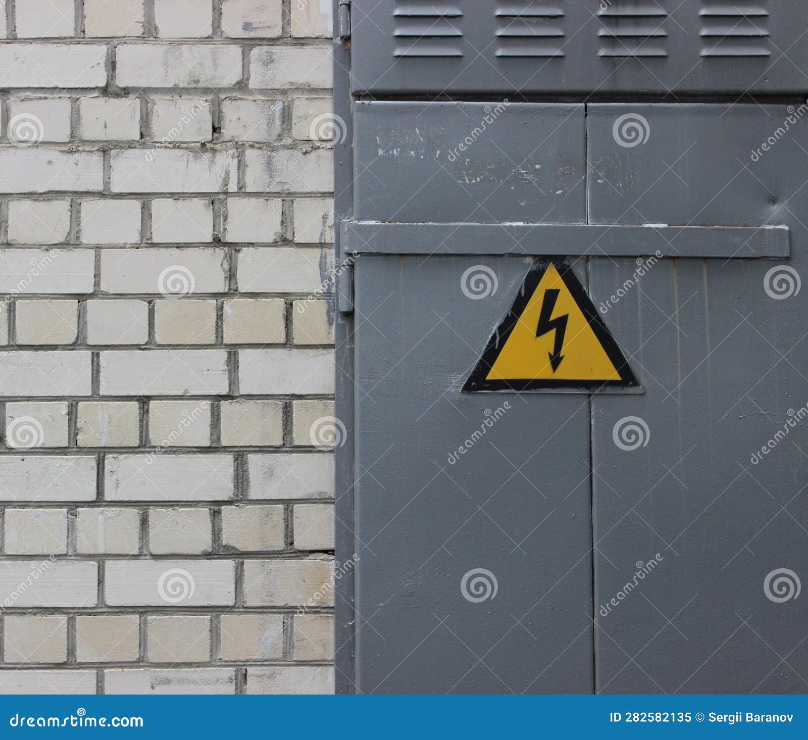 High Voltage Sign on a Steel Door on a White Brick Wall Texture ...