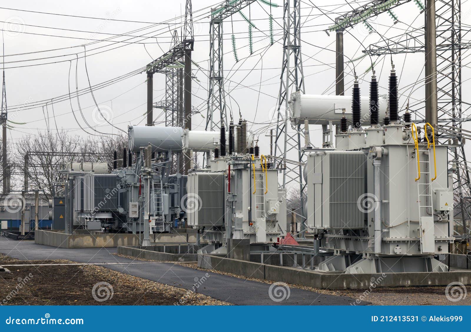 High Voltage Transformers at a Power Substation. High Voltage. High ...
