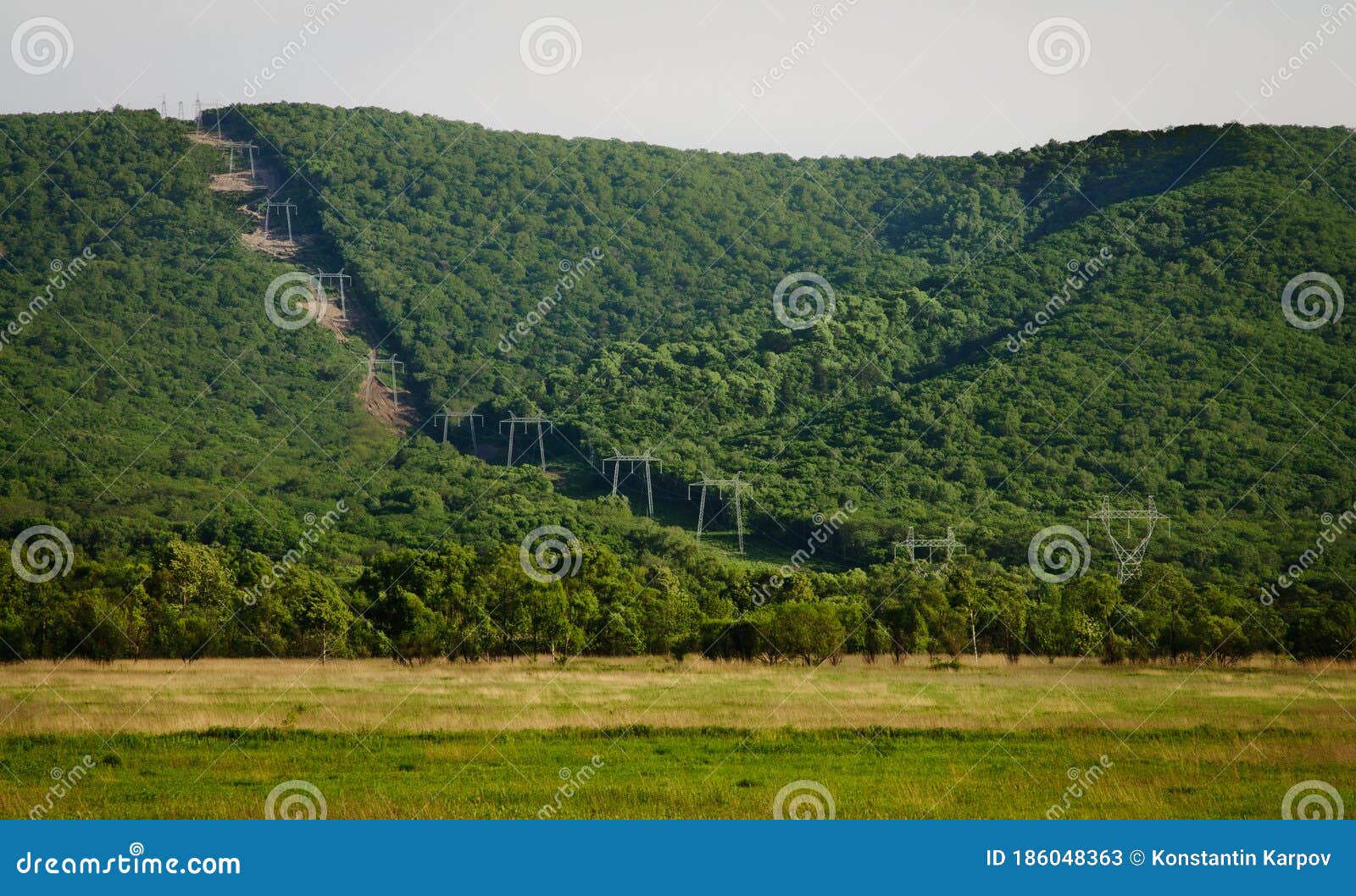 High Voltage Transmission Line Pass through the Forest and Mountain ...