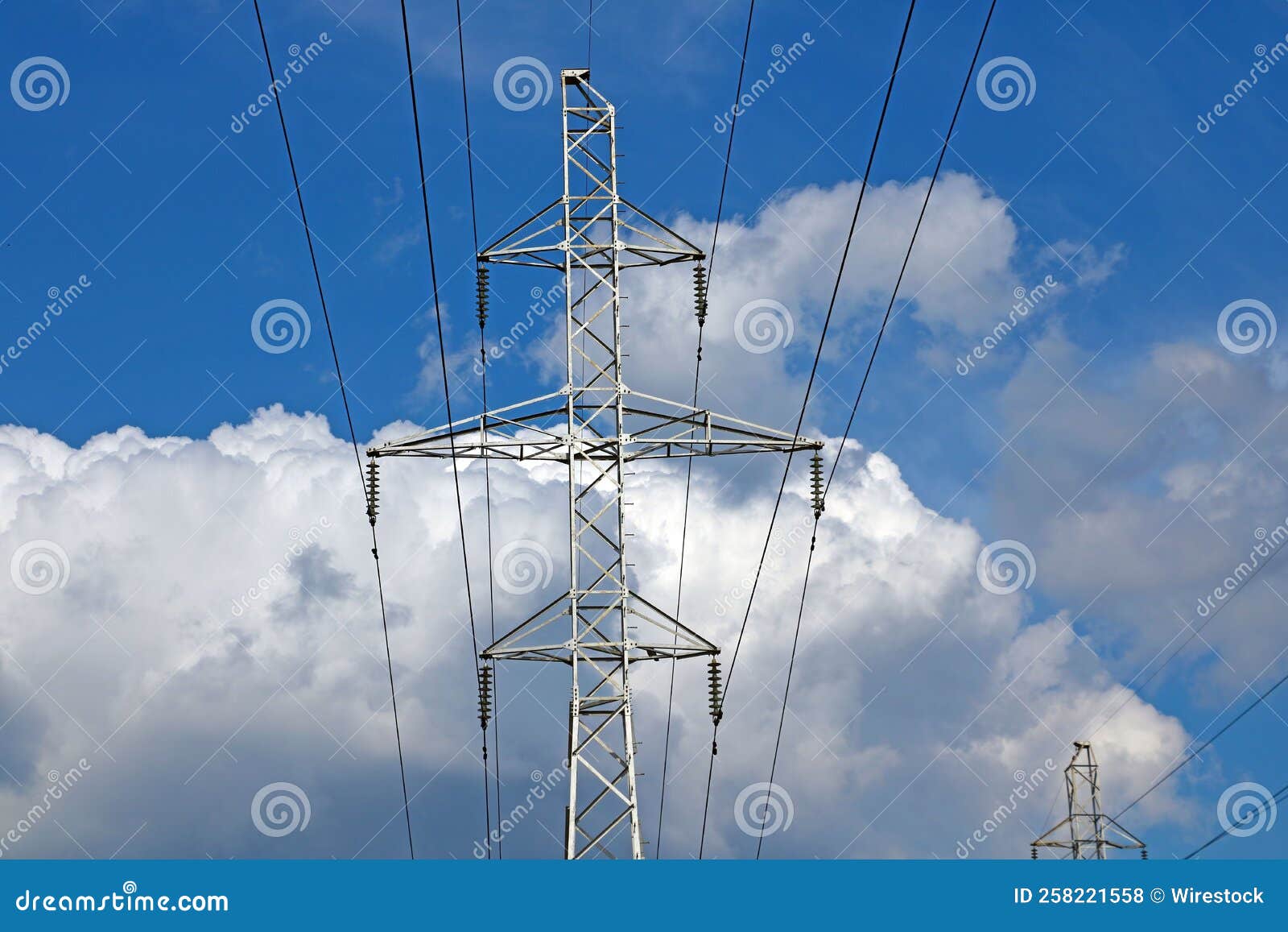 High Voltage Transmission Tower Against a Cloudy Sky Stock Photo ...