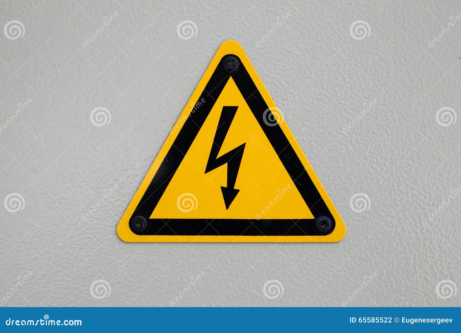 High Voltage Triangle Warning Sign Mounted on Gray Stock Photo - Image ...