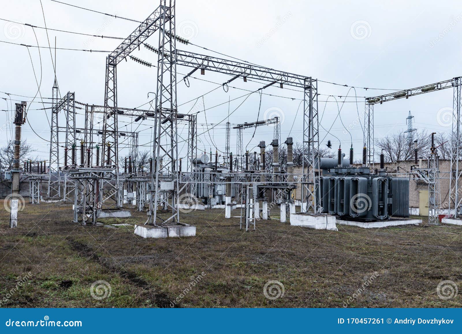 High Voltage Urban Electrical Substation with High Voltage Wires and ...