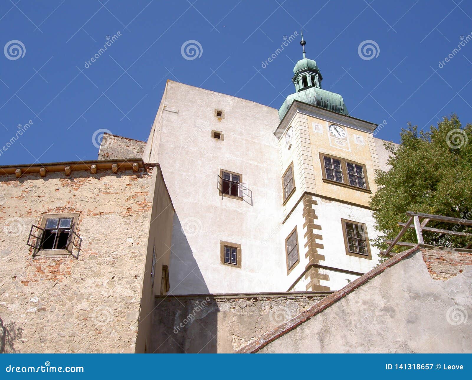 High Wall of the Castle with Clock Tower and the Extension Stock Image ...