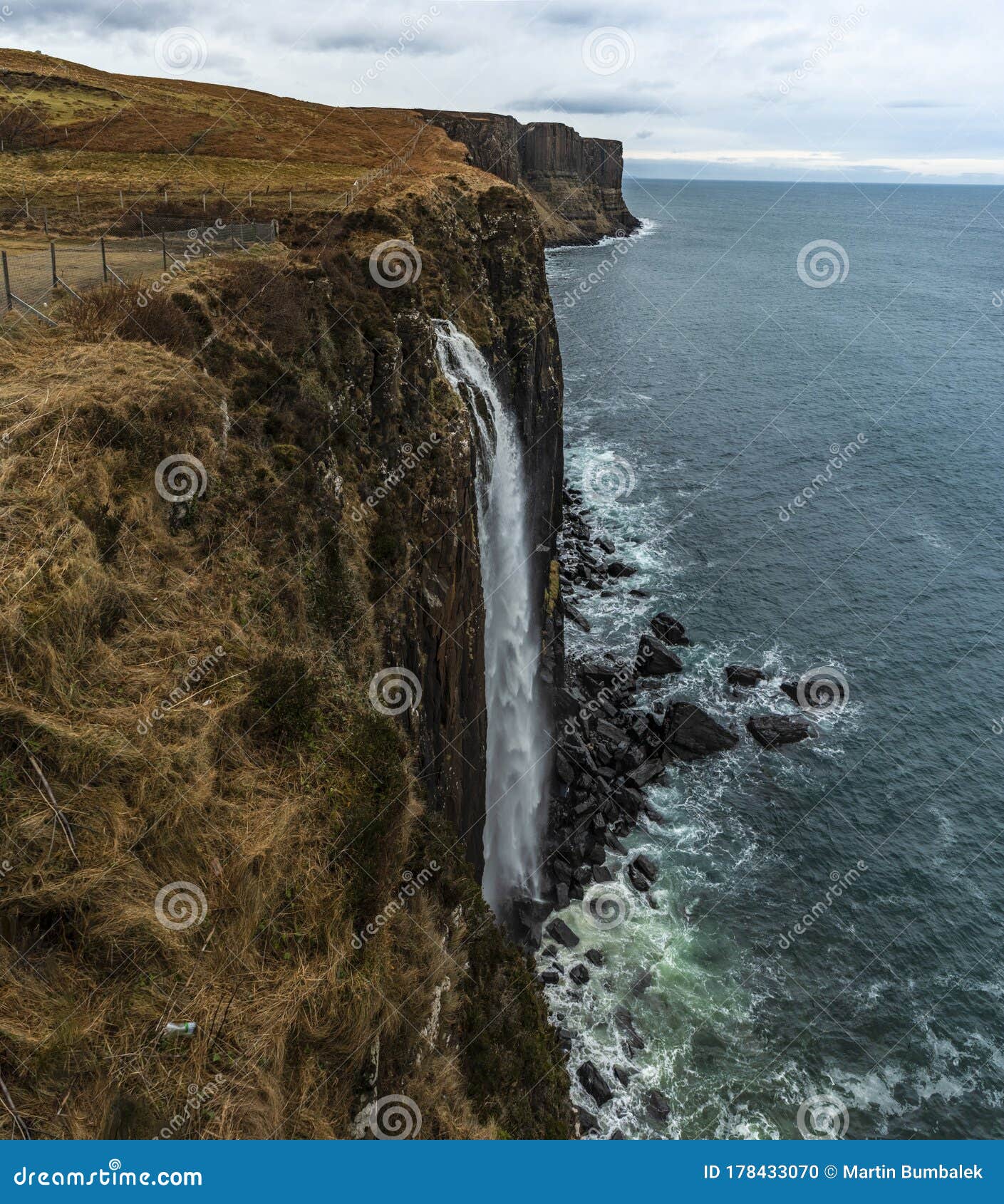 High Waterfall Falling Down into the Ocean Stock Photo - Image of rocks ...
