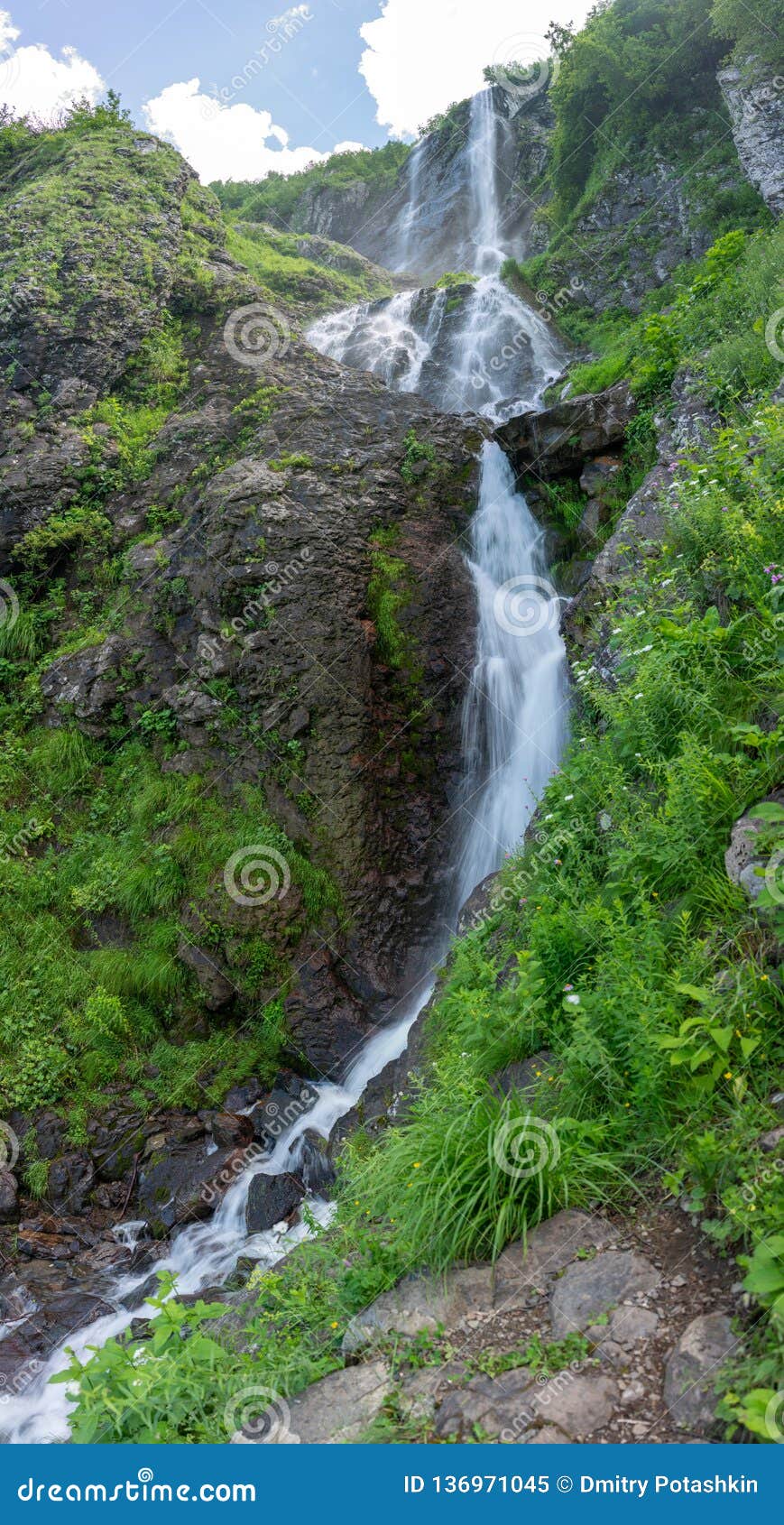 High Waterfall with a Powerful Stream Falling from a Cliff Stock Image ...