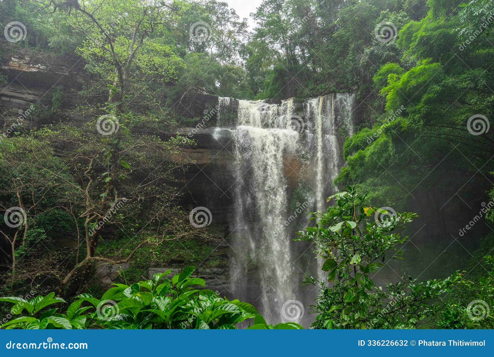 High Waterfall with Rock Layer in the Deep Forest Stock Photo - Image ...
