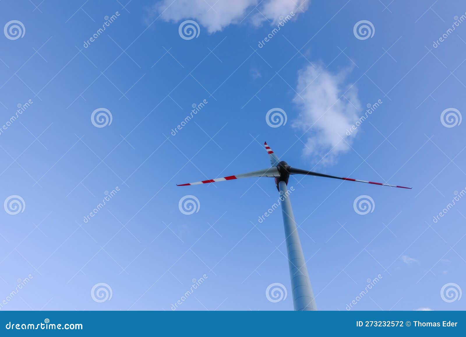 High Windmill and Soft Clouds on Blue Sky for Clean Energy Stock Photo ...