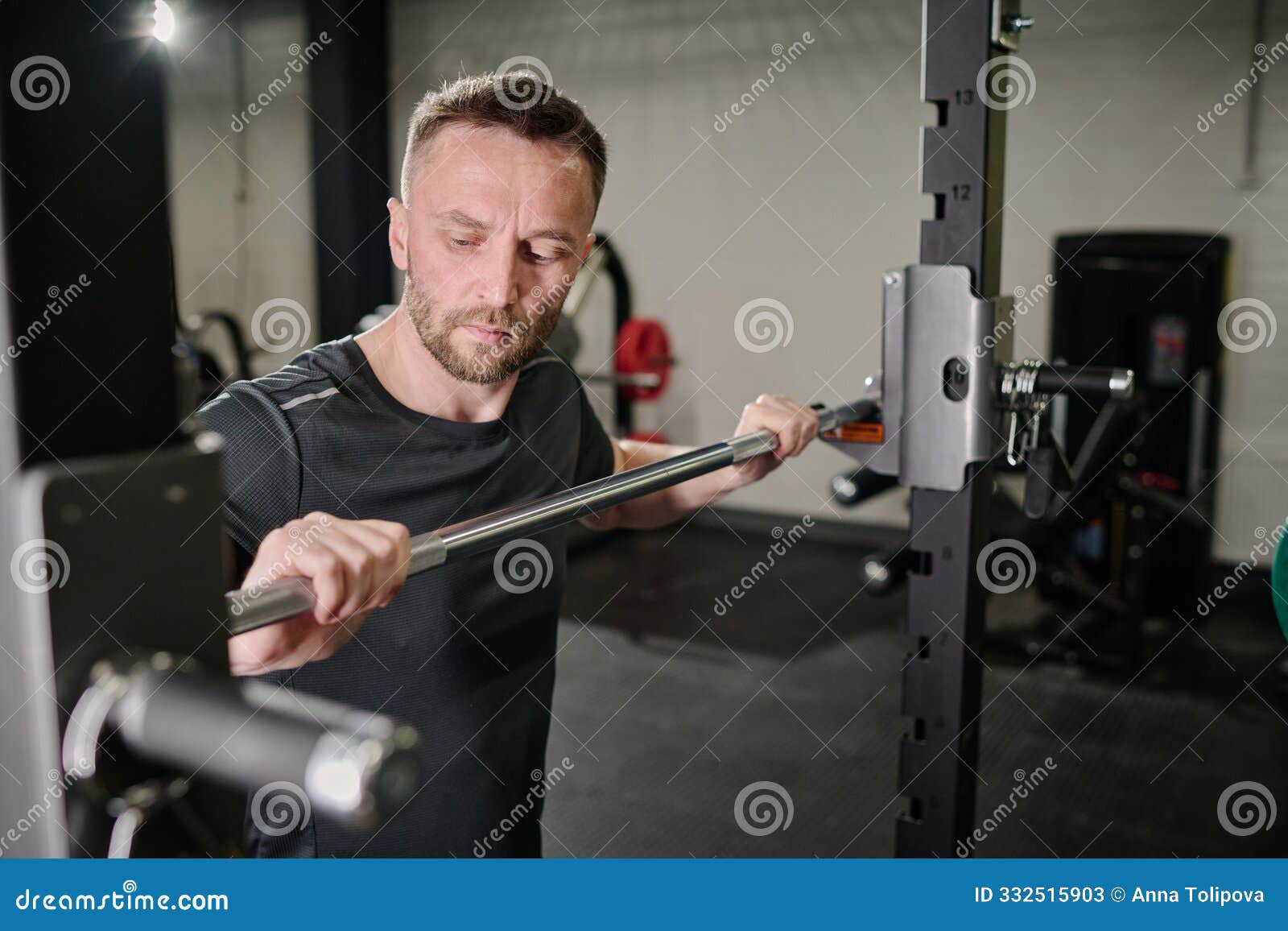 Man Using Smith Machine stock image. Image of resident - 332515903