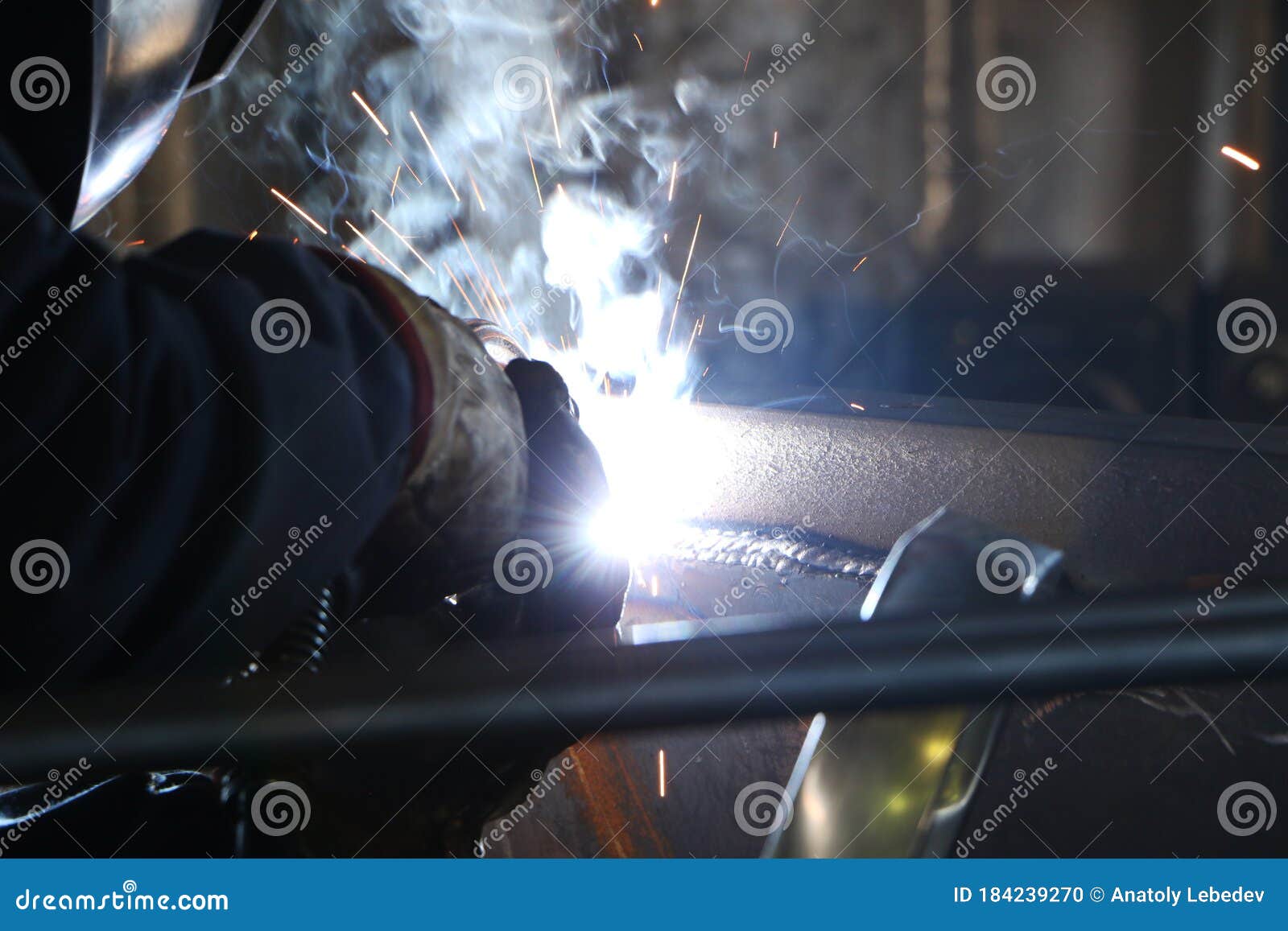 A Highly Skilled Welder Welds a Metal Structure at an Assembly Plant ...
