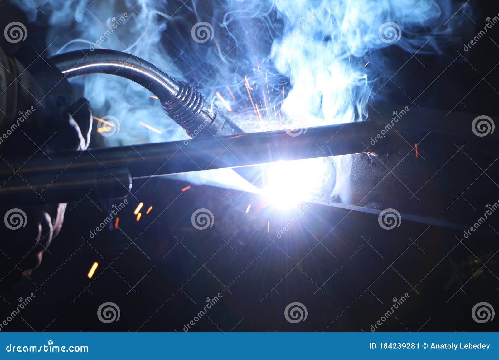 A Highly Skilled Welder Welds a Metal Structure at an Assembly Plant ...