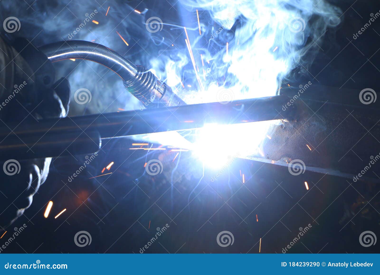A Highly Skilled Welder Welds a Metal Structure at an Assembly Plant ...