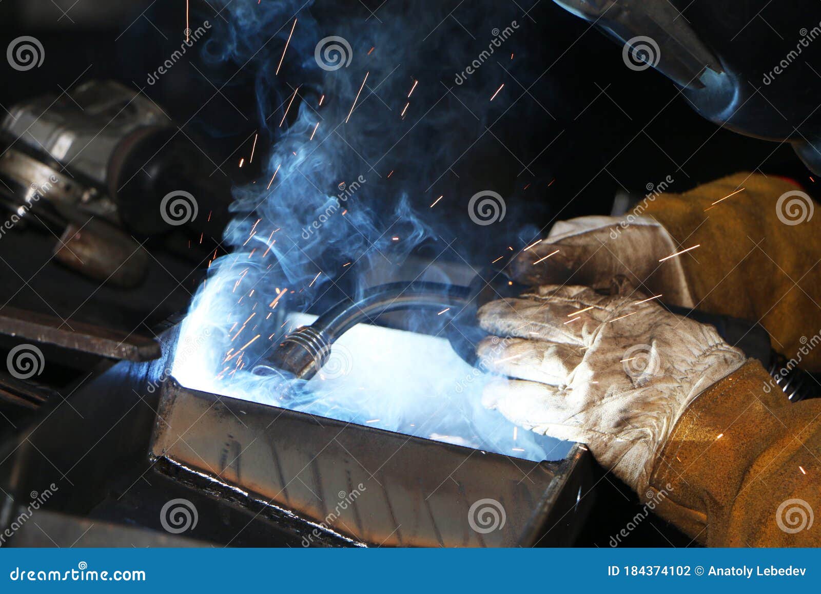 A Highly Skilled Welder Welds a Metal Structure at an Assembly Plant ...