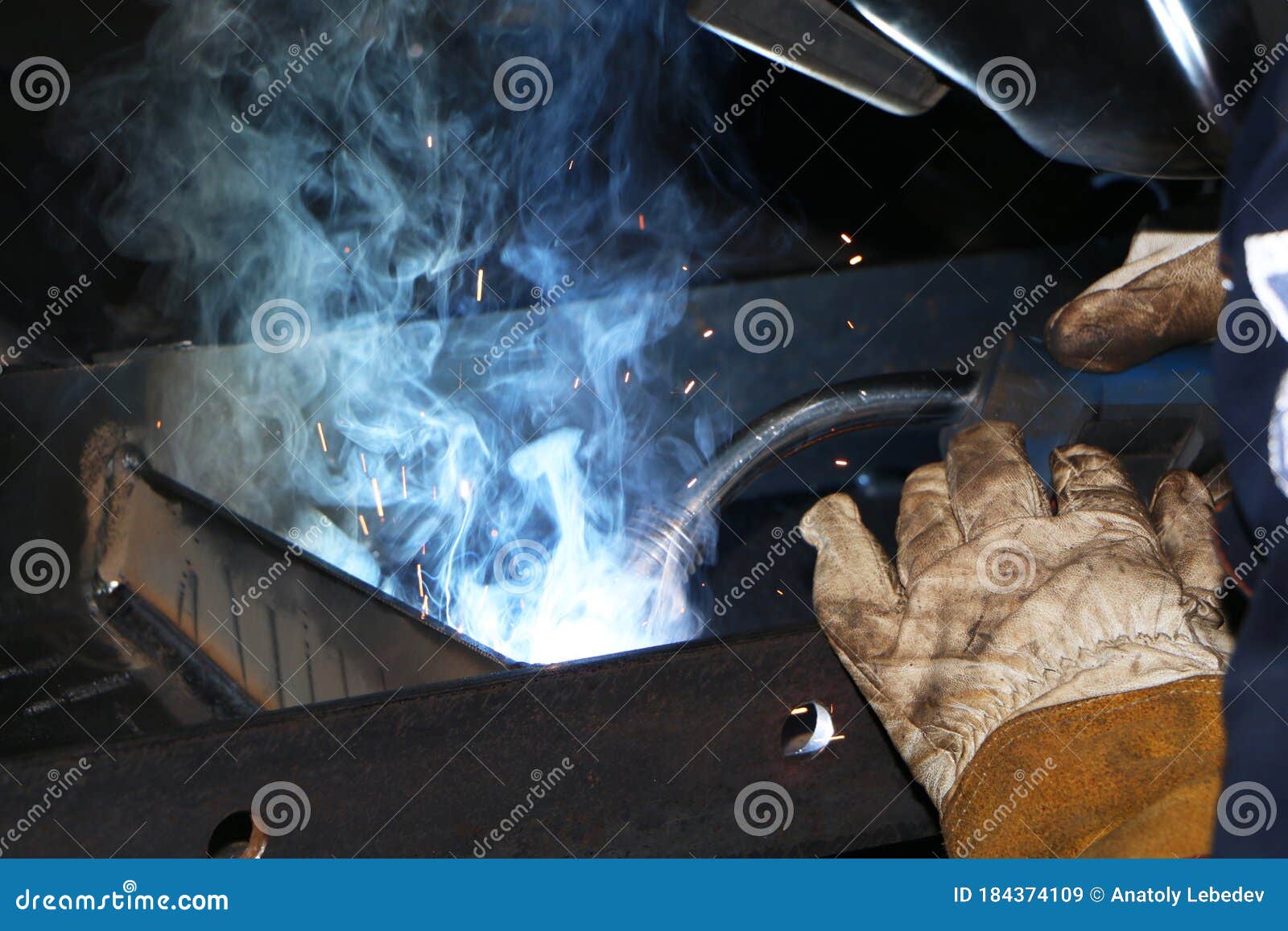 A Highly Skilled Welder Welds a Metal Structure at an Assembly Plant ...
