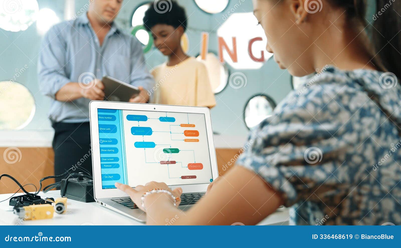 Highschool Girl Writing Prompt while Boy Looking at Teacher Tablet ...