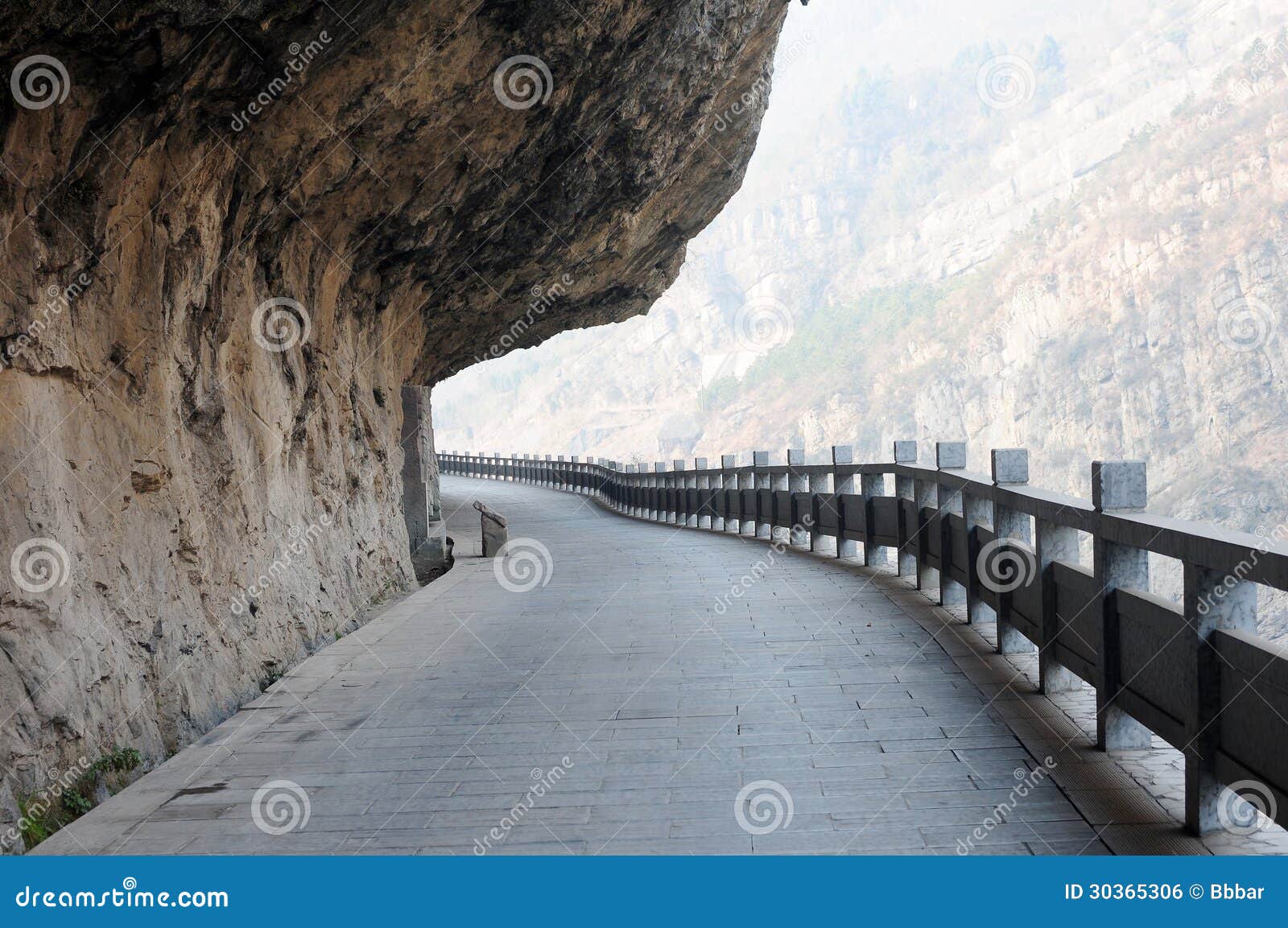 Highway Built Under a Cliff Stock Photo - Image of landscape, travel ...