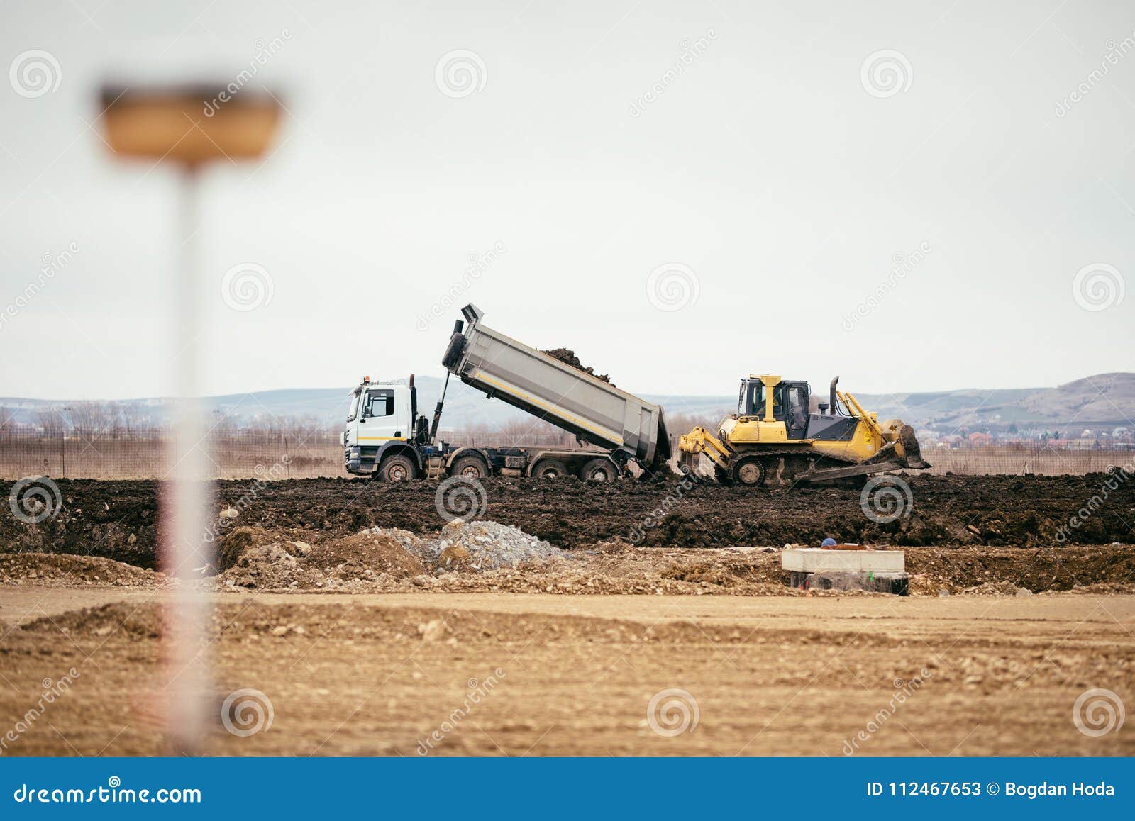 Highway Construction Site Development with Dumper Truck Dumping Earth ...