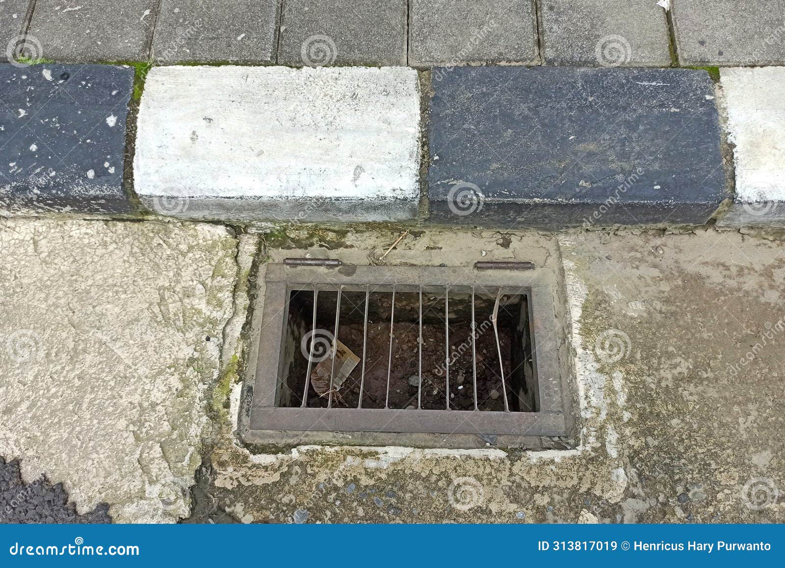 A Highway Drain Hole that is Rectangular in Shape and Covered with Iron ...