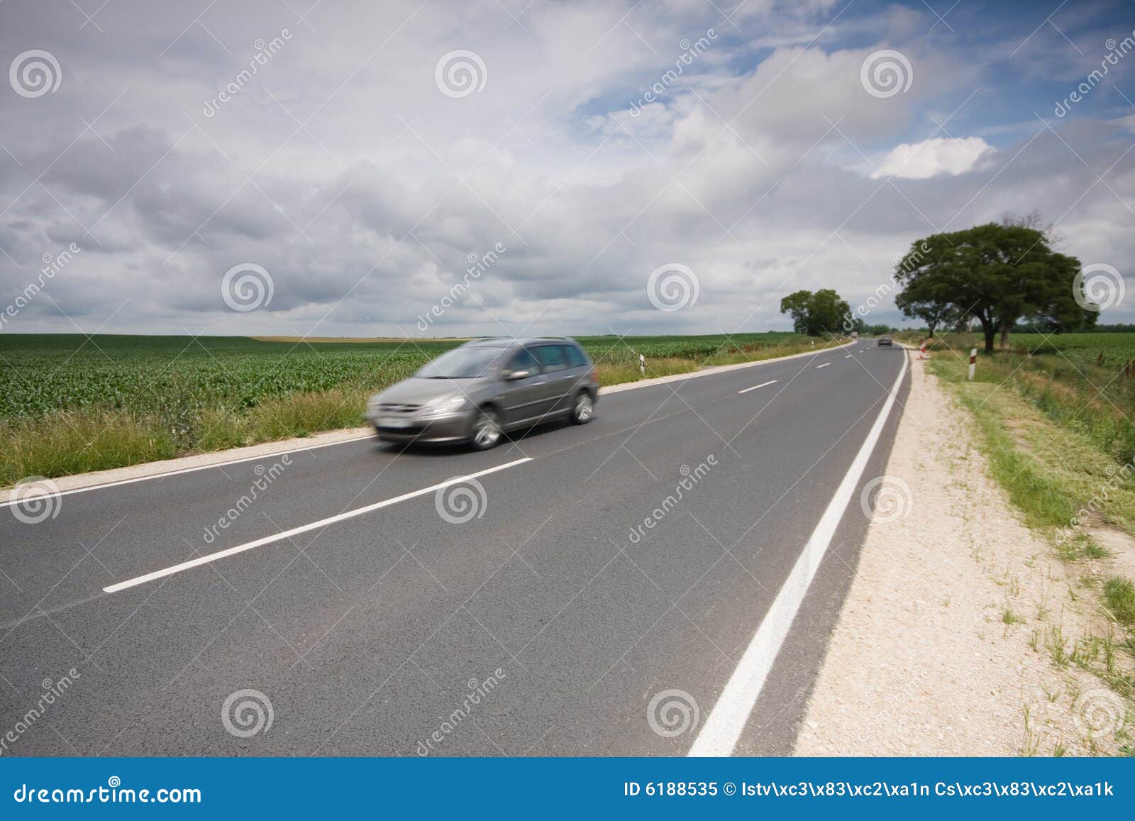 Highway with a fast car stock image. Image of grass, asphalt - 6188535