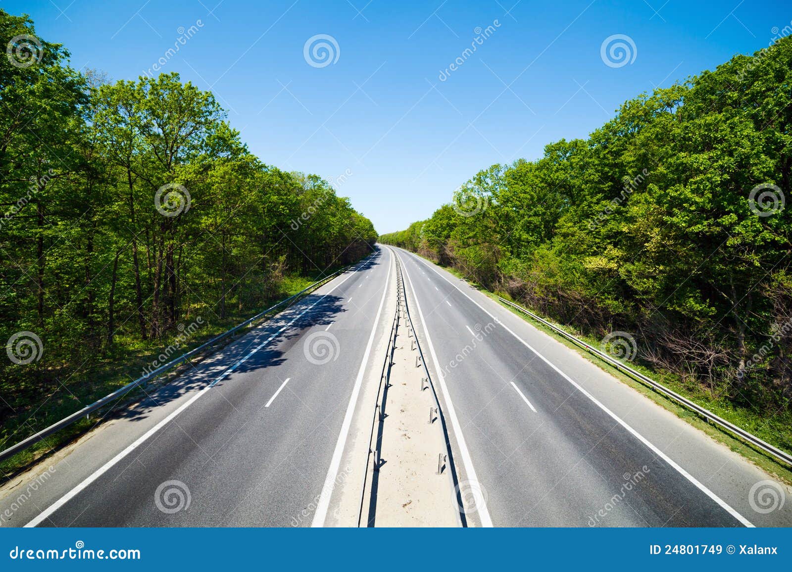 Highway through forest stock image. Image of country - 24801749