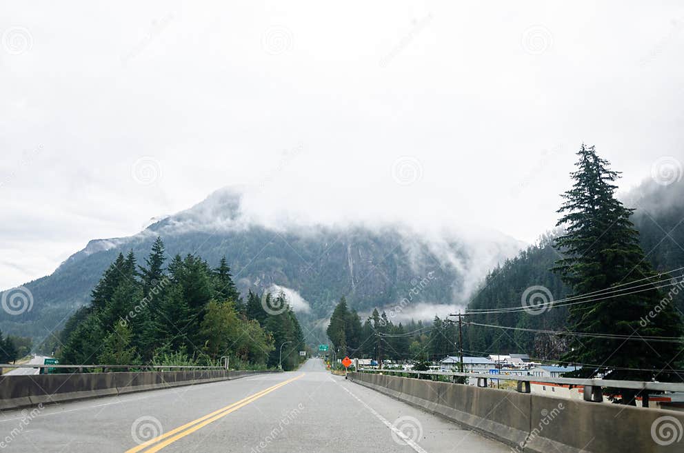 Highway in Hope BC, Canada with Cloud Covered Mountains in the ...