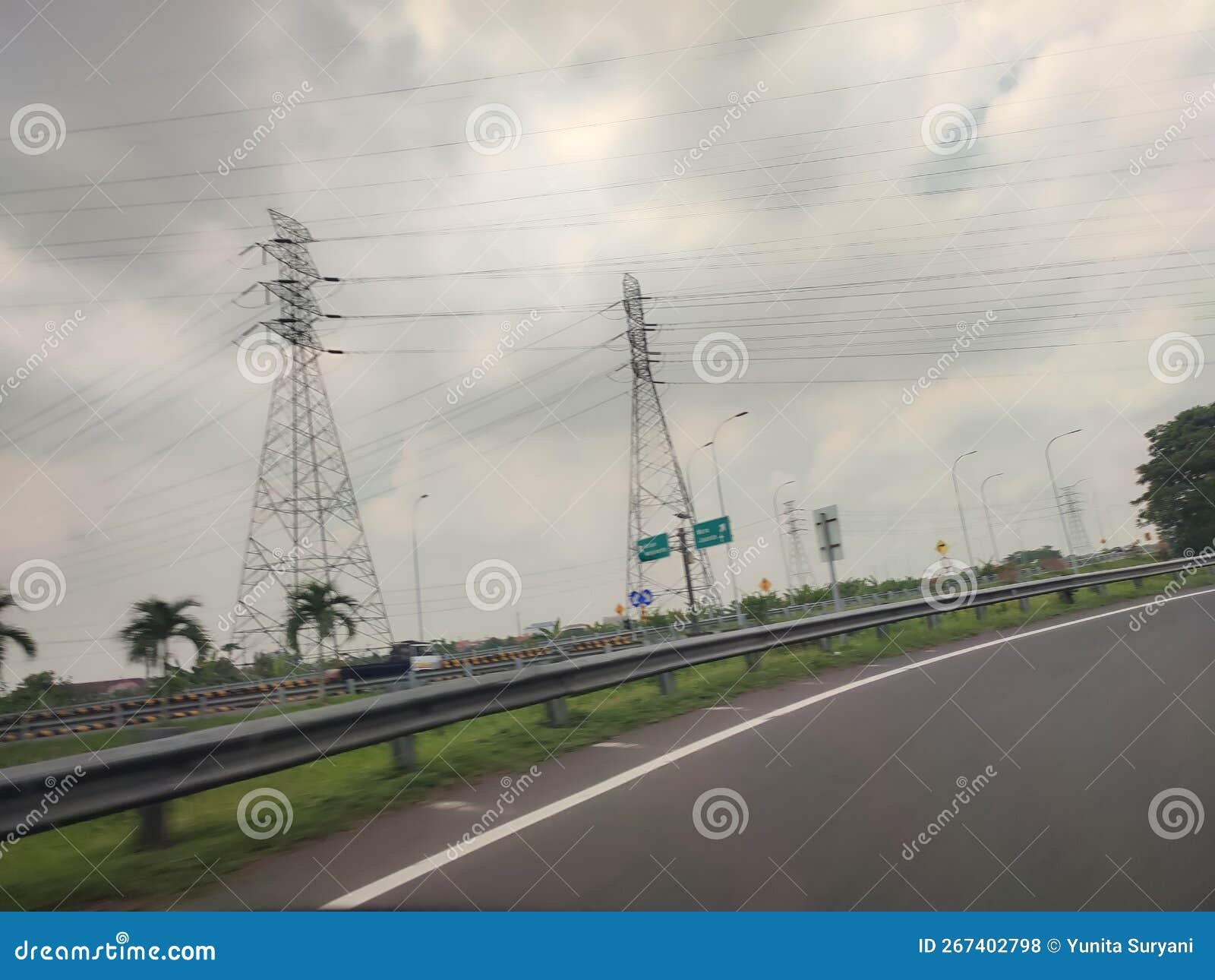 A Highway Street with Electrical Towers Stock Photo - Image of lane ...