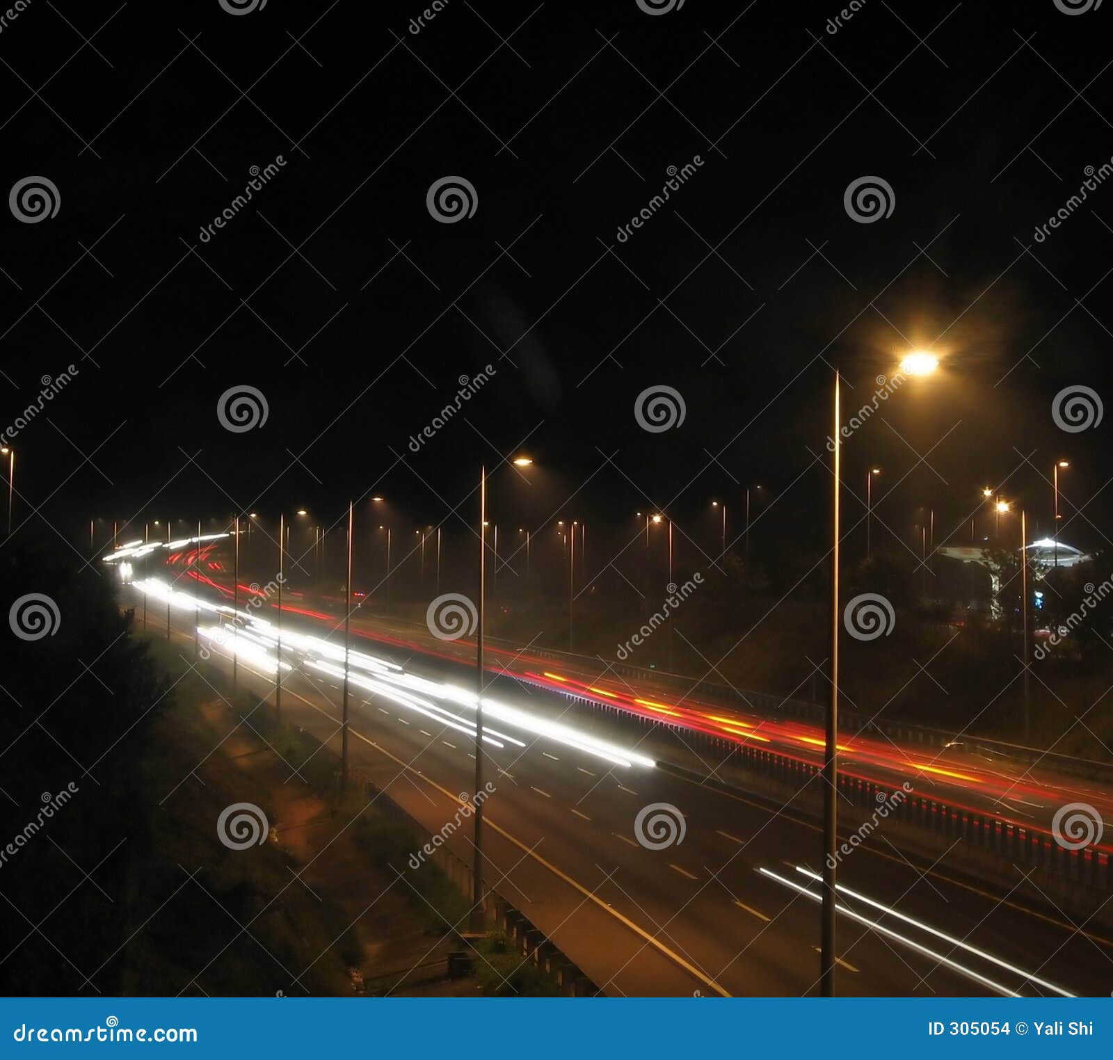Highway Traffic at Night stock photo. Image of barrier - 305054