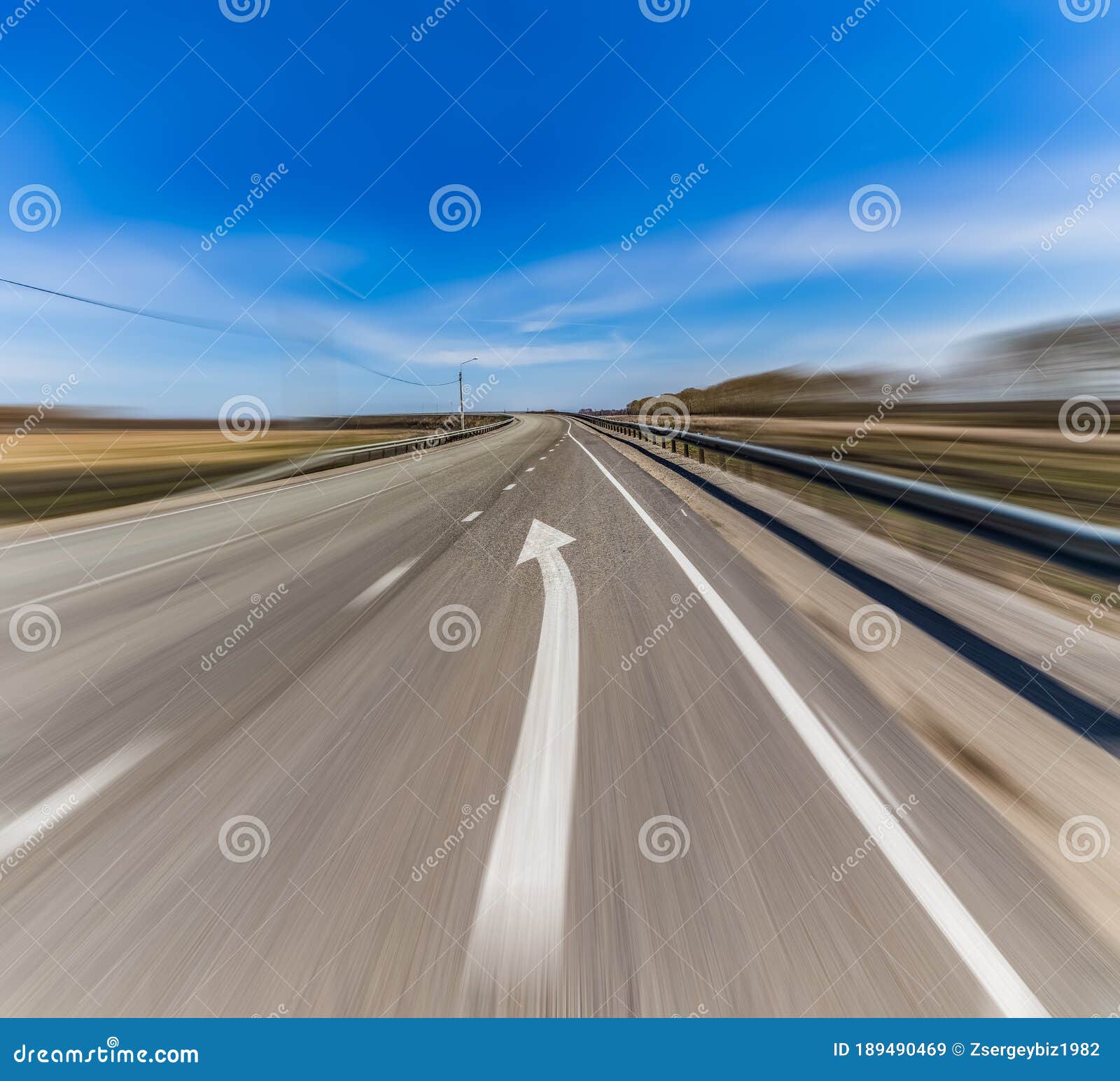 Highway with White Arrow Sign Pointing Forward Stock Image - Image of ...