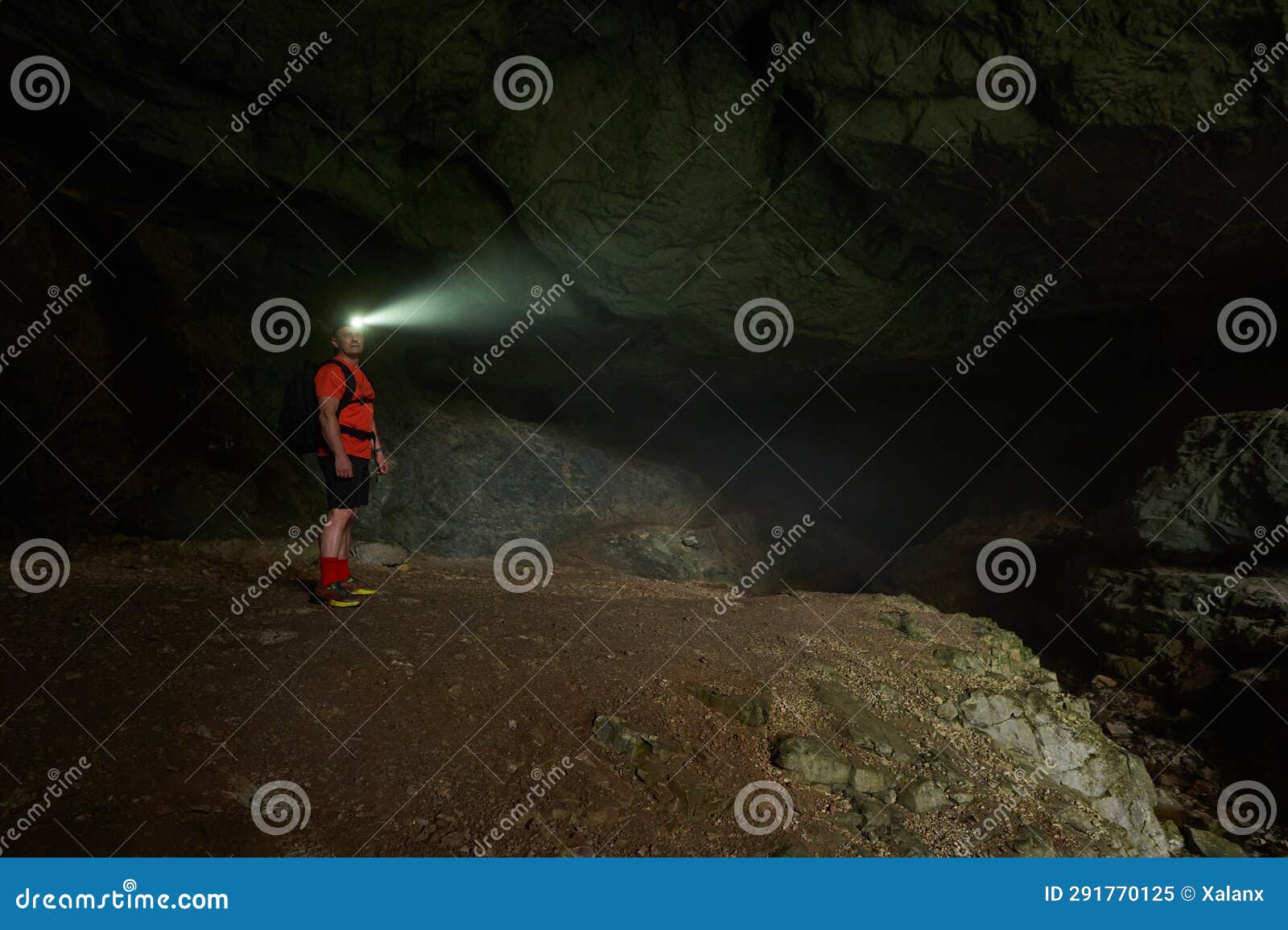 Hiker with Backpack Exploring a Cave Stock Image - Image of cave ...