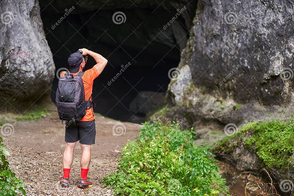 Hiker with Backpack Exploring a Cave Stock Image - Image of nature ...