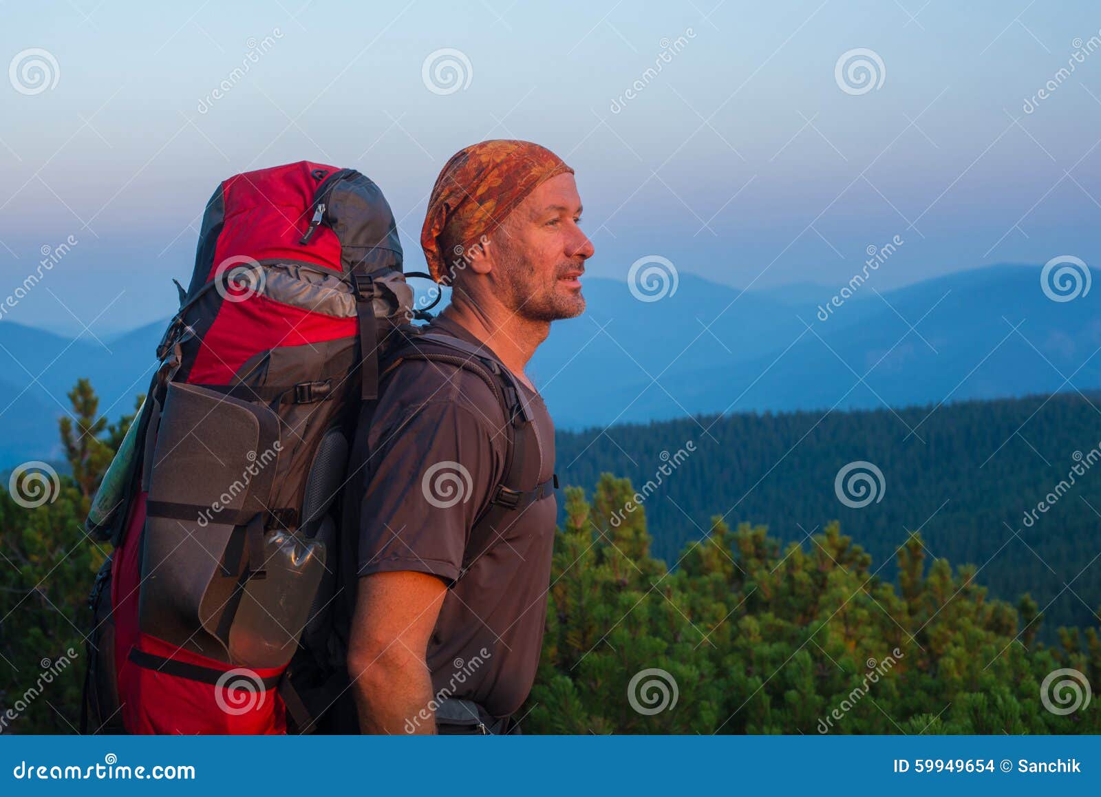 Hiker with Backpack Looks into the Distance Stock Photo - Image of ...
