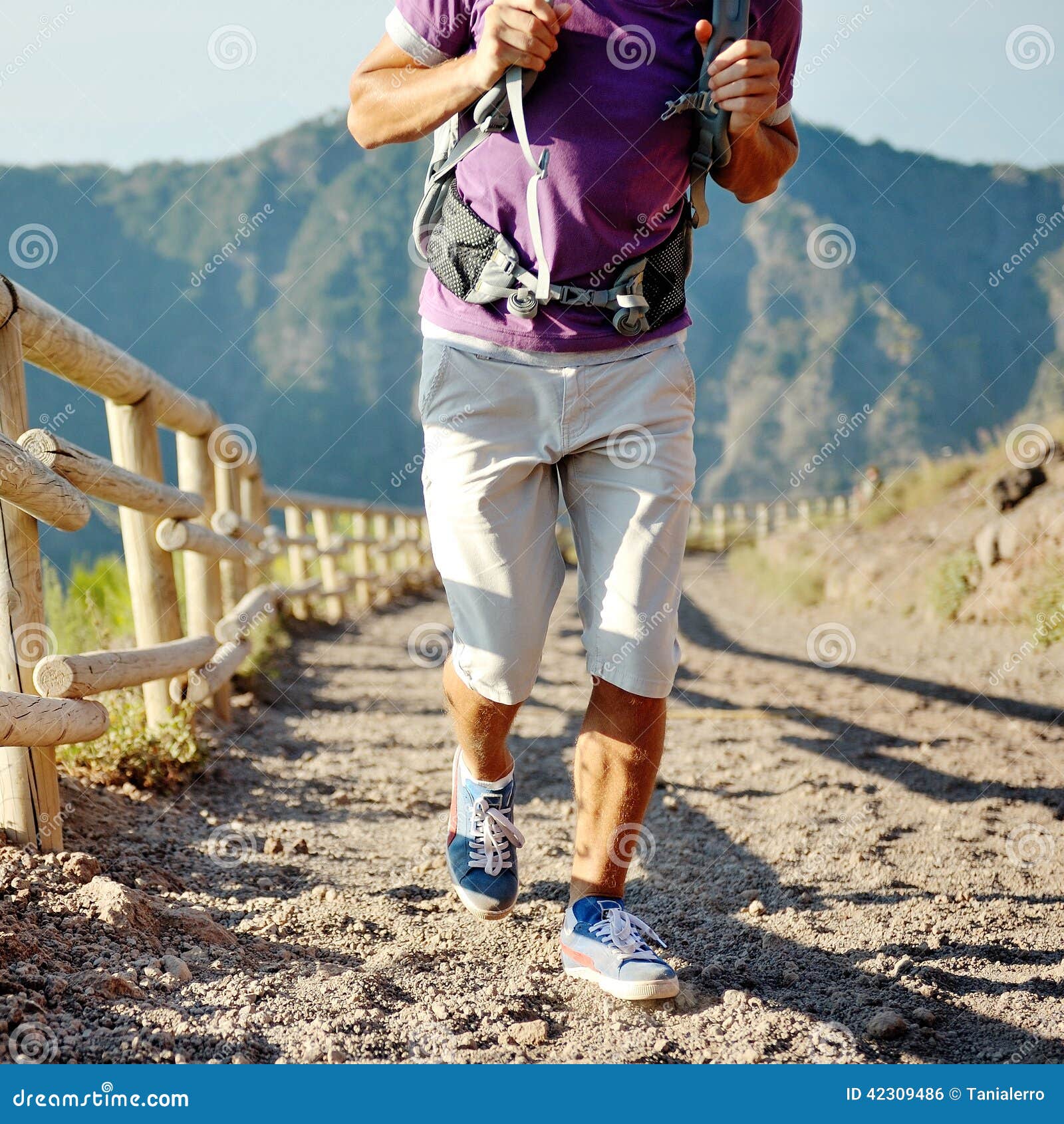 Hiker with Backpack Running on a Path of Mountain Stock Photo - Image ...