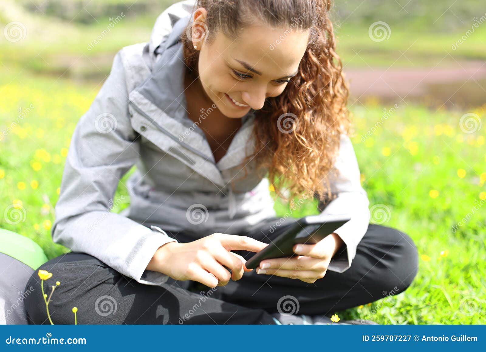 Hiker Checking Smart Phone in the Mountain Stock Image - Image of field ...